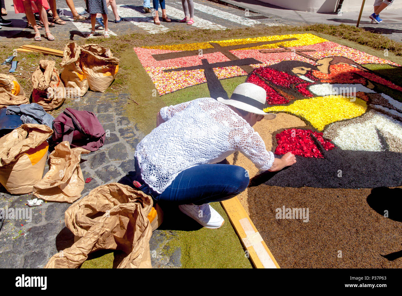 artisan making a natural tapestry on the streets of La Orotava during ...
