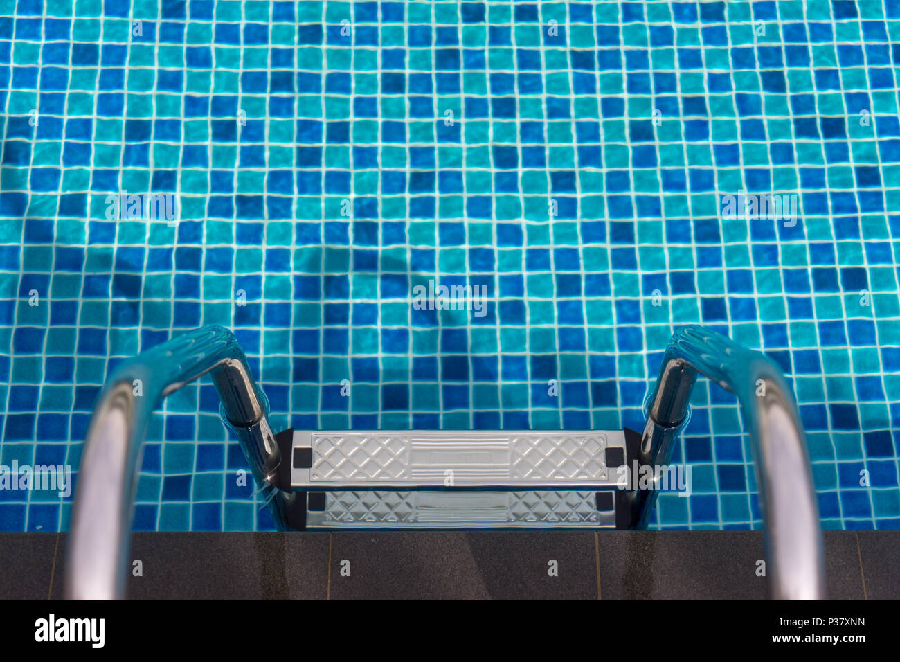 Beautiful luxury swimming pool with clear water on sunny day and Pool ...