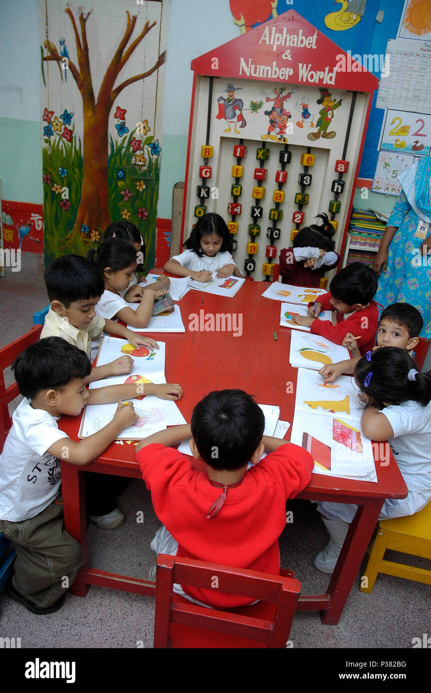 Students of an English medium school in Dhaka reading in the class room ...