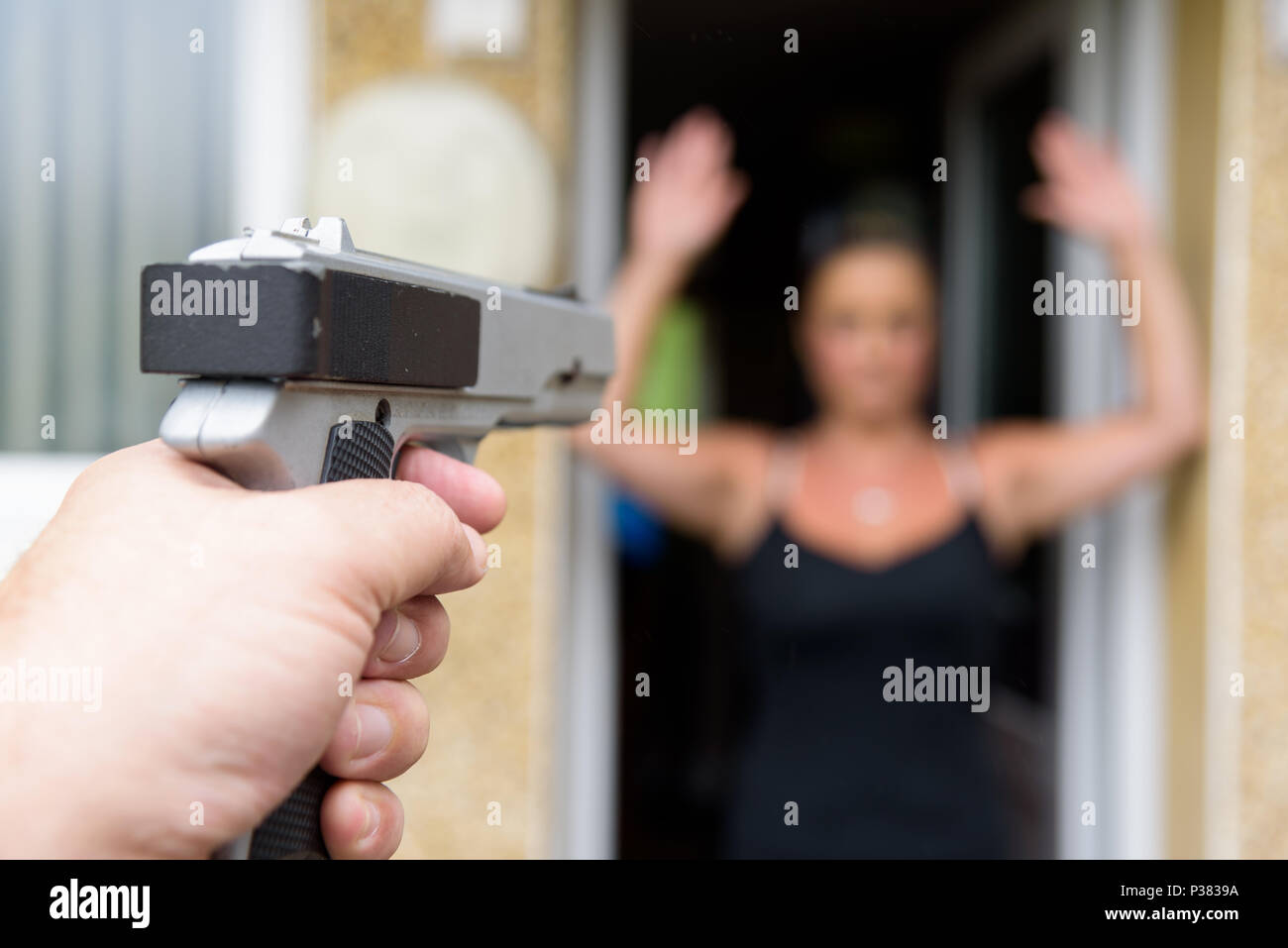 Woman held at gunpoint hi-res stock photography and images - Alamy