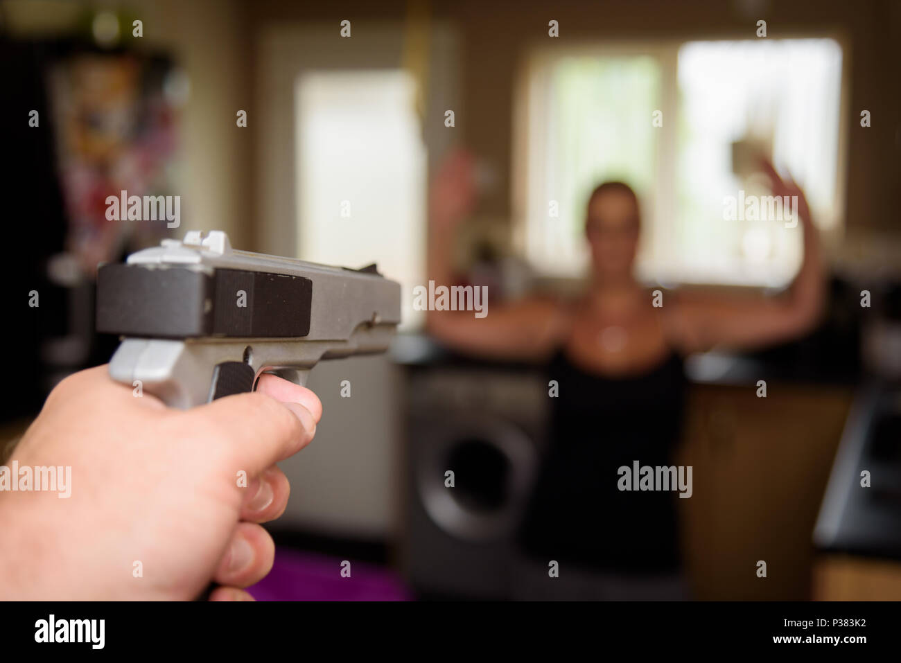 Woman held at gunpoint hi-res stock photography and images - Alamy