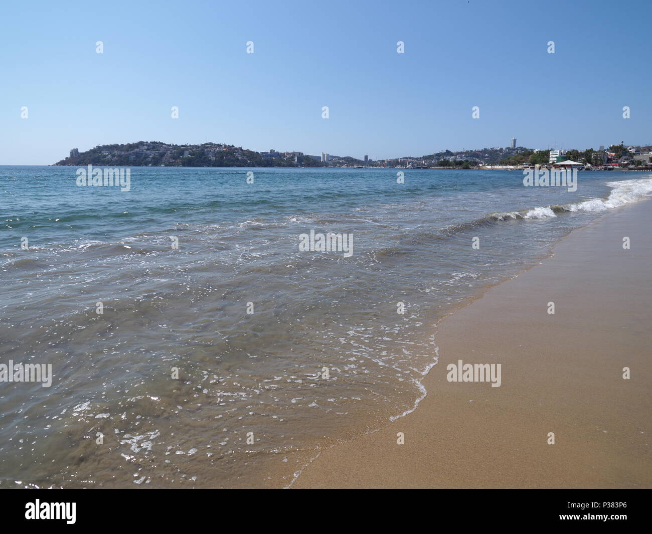 Sandy beach at bay of ACAPULCO city in Mexico with panoramic view and ...