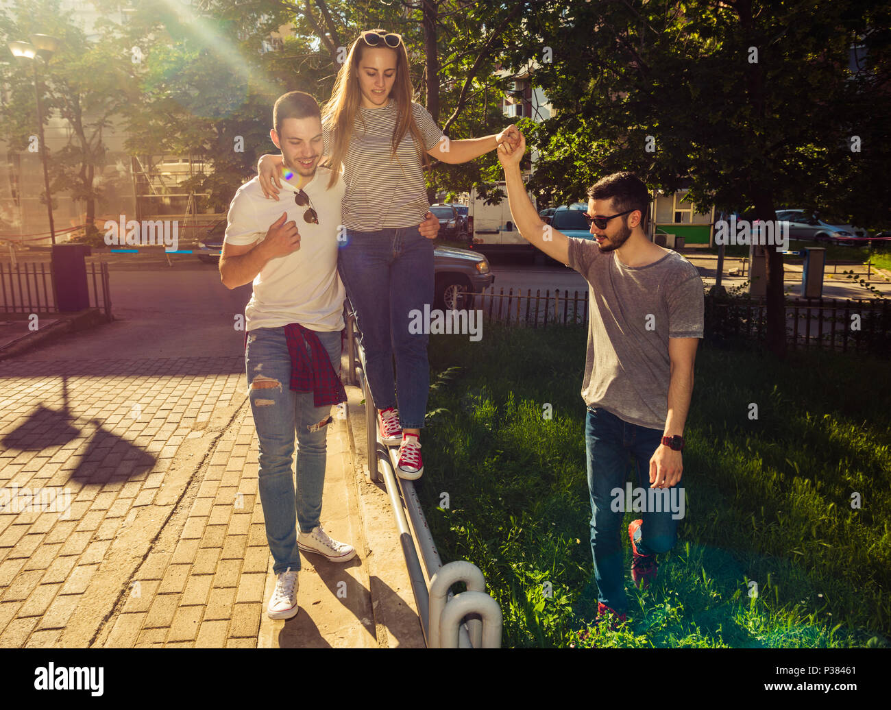 Happy young people walking down the city street and having fun Stock ...