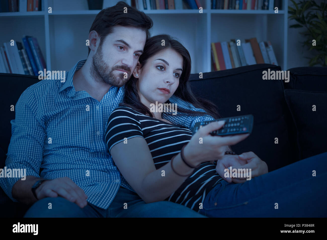 Couple watching tv night hi-res stock photography and images - Alamy