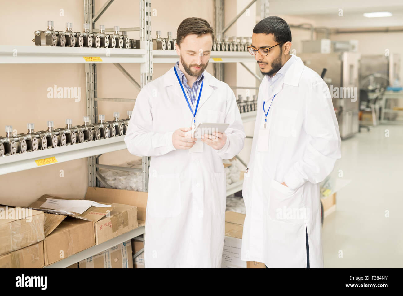 Teamwork at Warehouse of Measuring Equipment Factory Stock Photo - Alamy