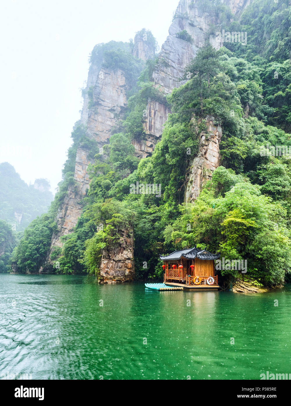 Baofeng Lake Boat Trip In A Rainy Day With Clouds And Mist At