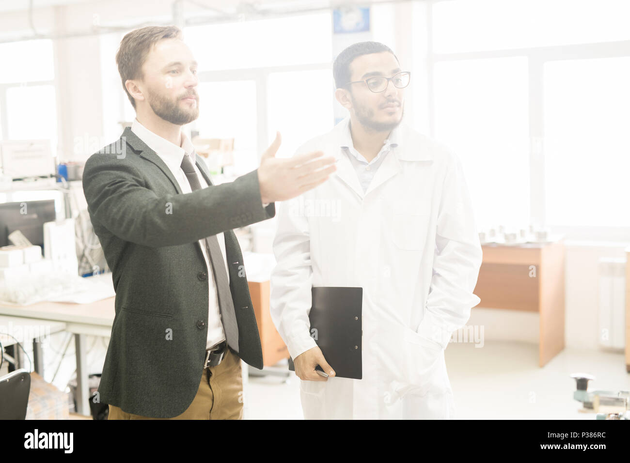 Giving Tour of Factory Production Department Stock Photo - Alamy