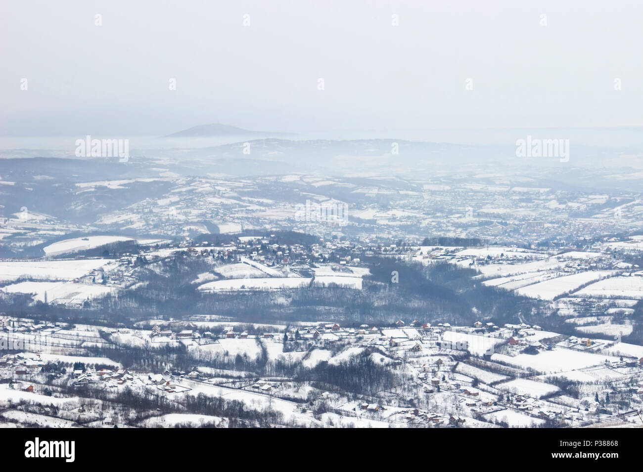 Winter landscape, hills and houses covered with snow Stock Photo - Alamy