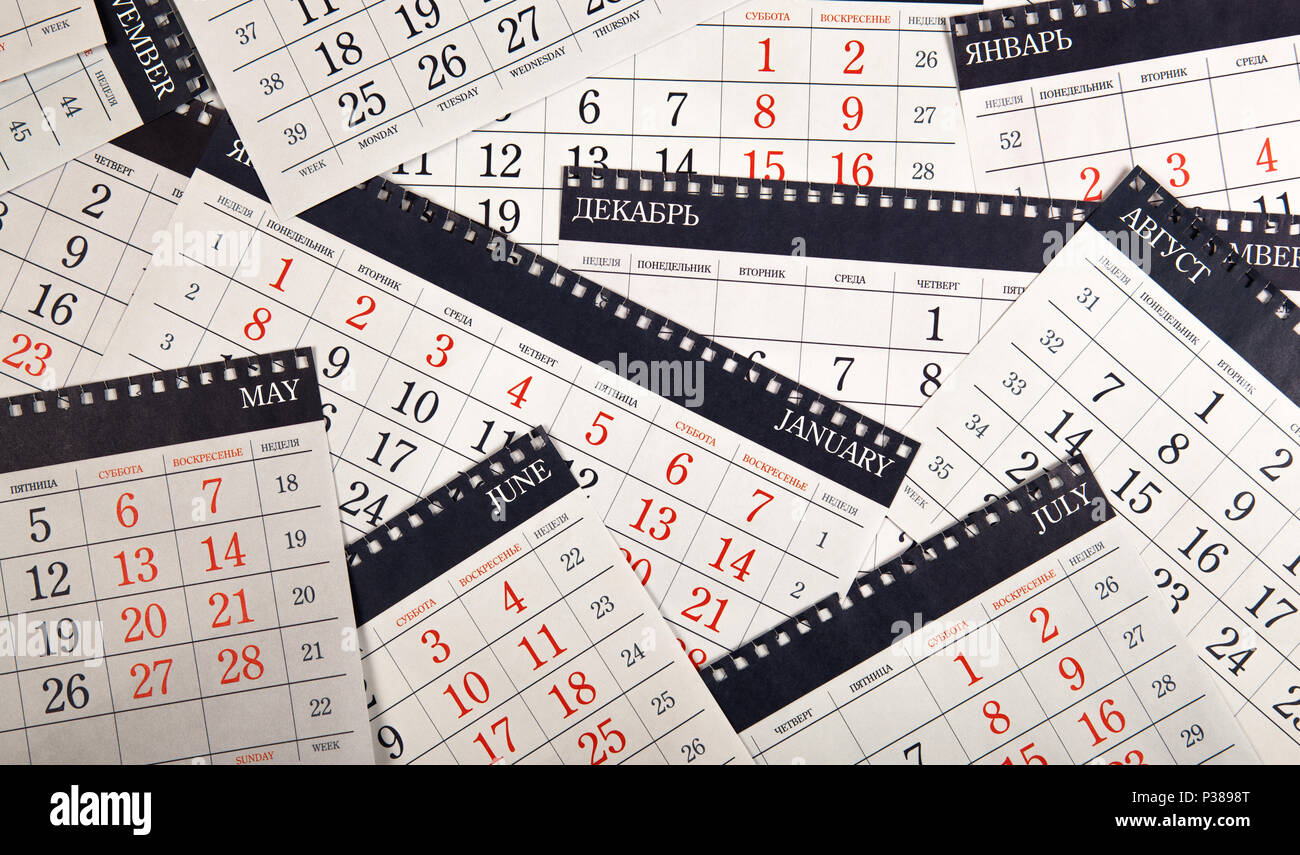 pile of wall calendar sheets on the table Stock Photo - Alamy