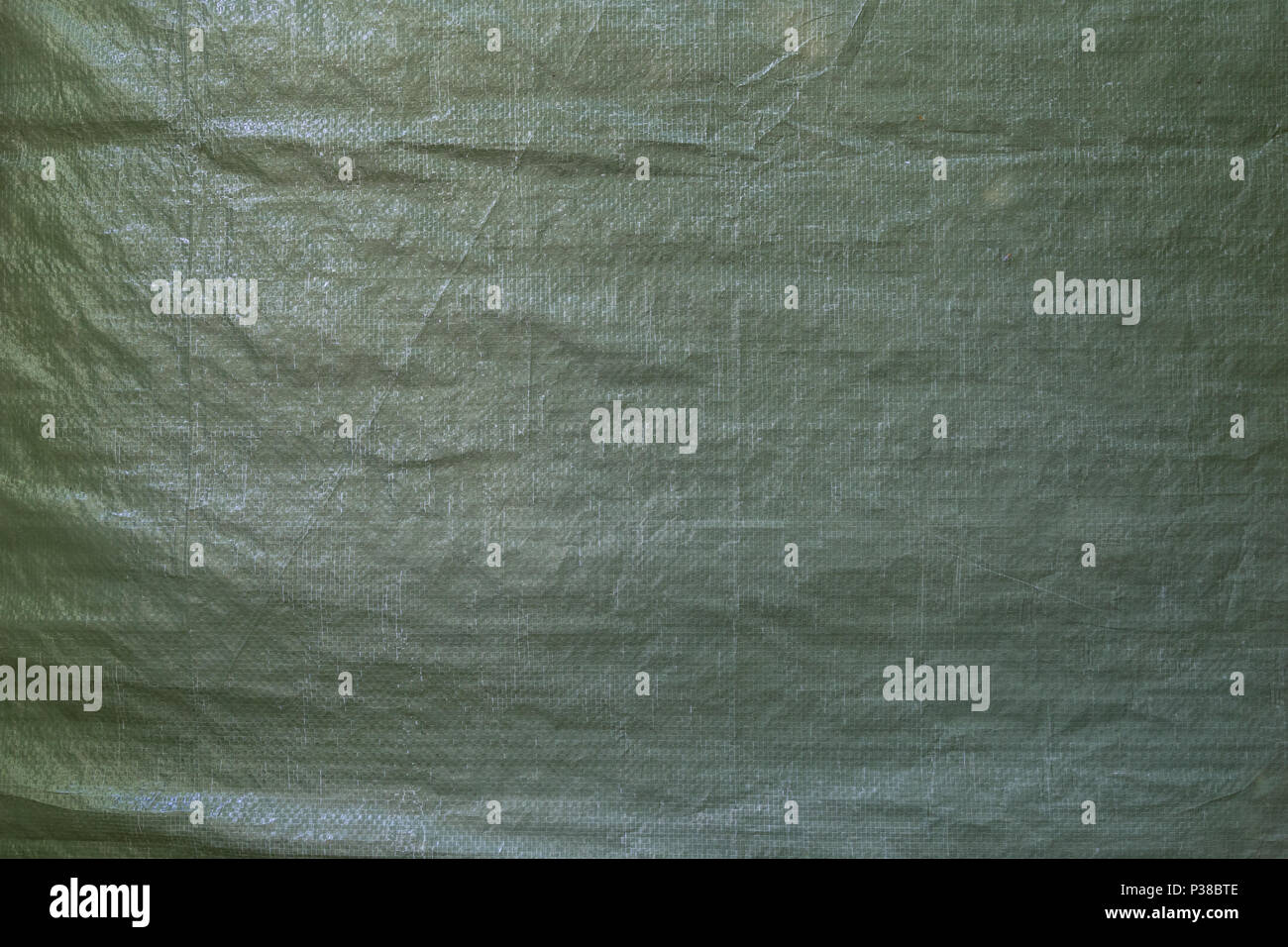 Full frame background of a wrinkled green tarp texture Stock Photo - Alamy
