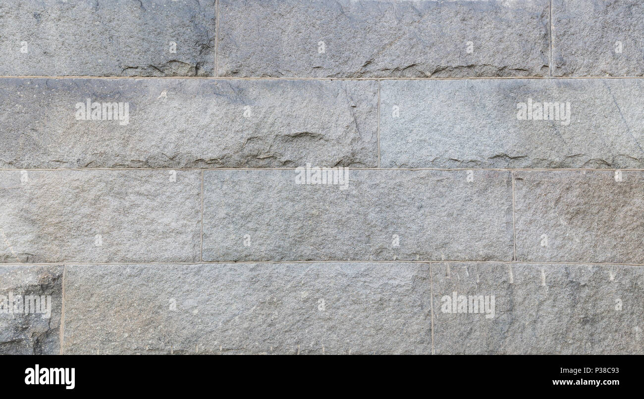 Full frame background of a wall made of big and rough stone blocks ...