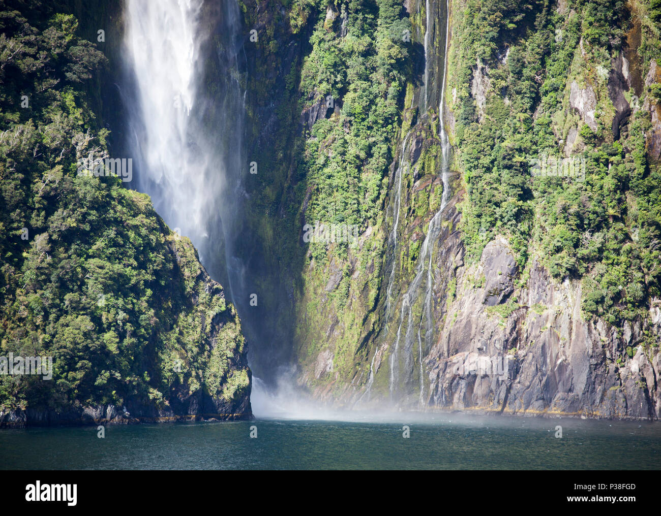The waterfall of Milford Sound in Fiordland national park (New Zealand ...