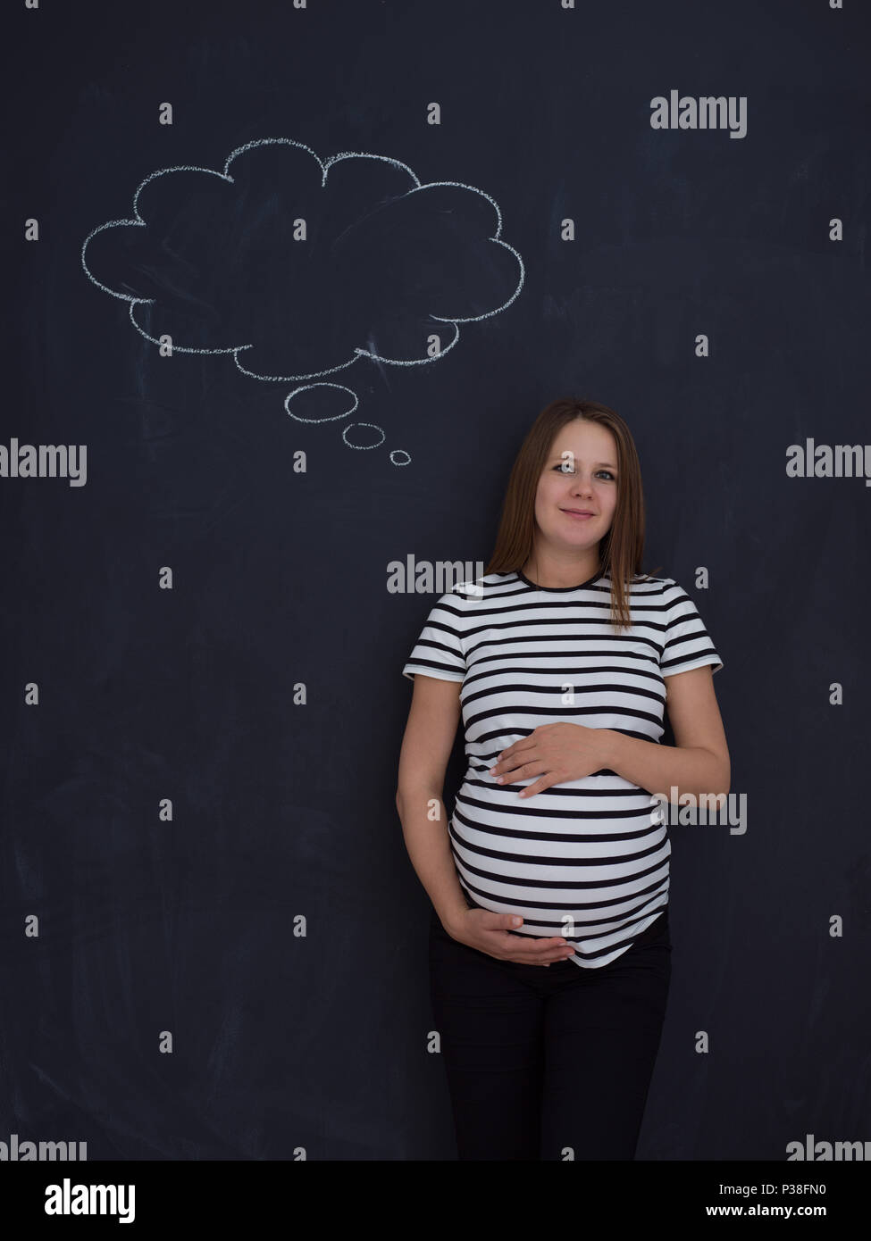 young pregnant woman thinking about names for her unborn baby to ...