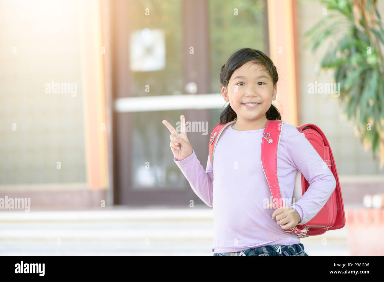 Happy student with backpack smiling at school, Back to school concept ...