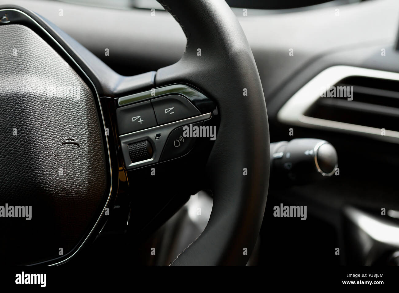Detail of the steering wheel buttons of a modern car Stock Photo - Alamy