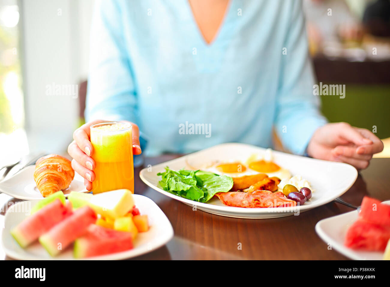 Woman eating eggs breakfast hi-res stock photography and images - Alamy
