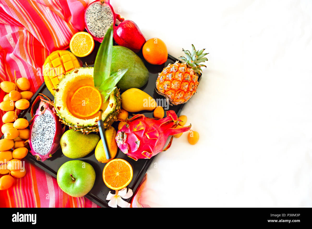 Exotic fruits on the tray. Close up Stock Photo - Alamy
