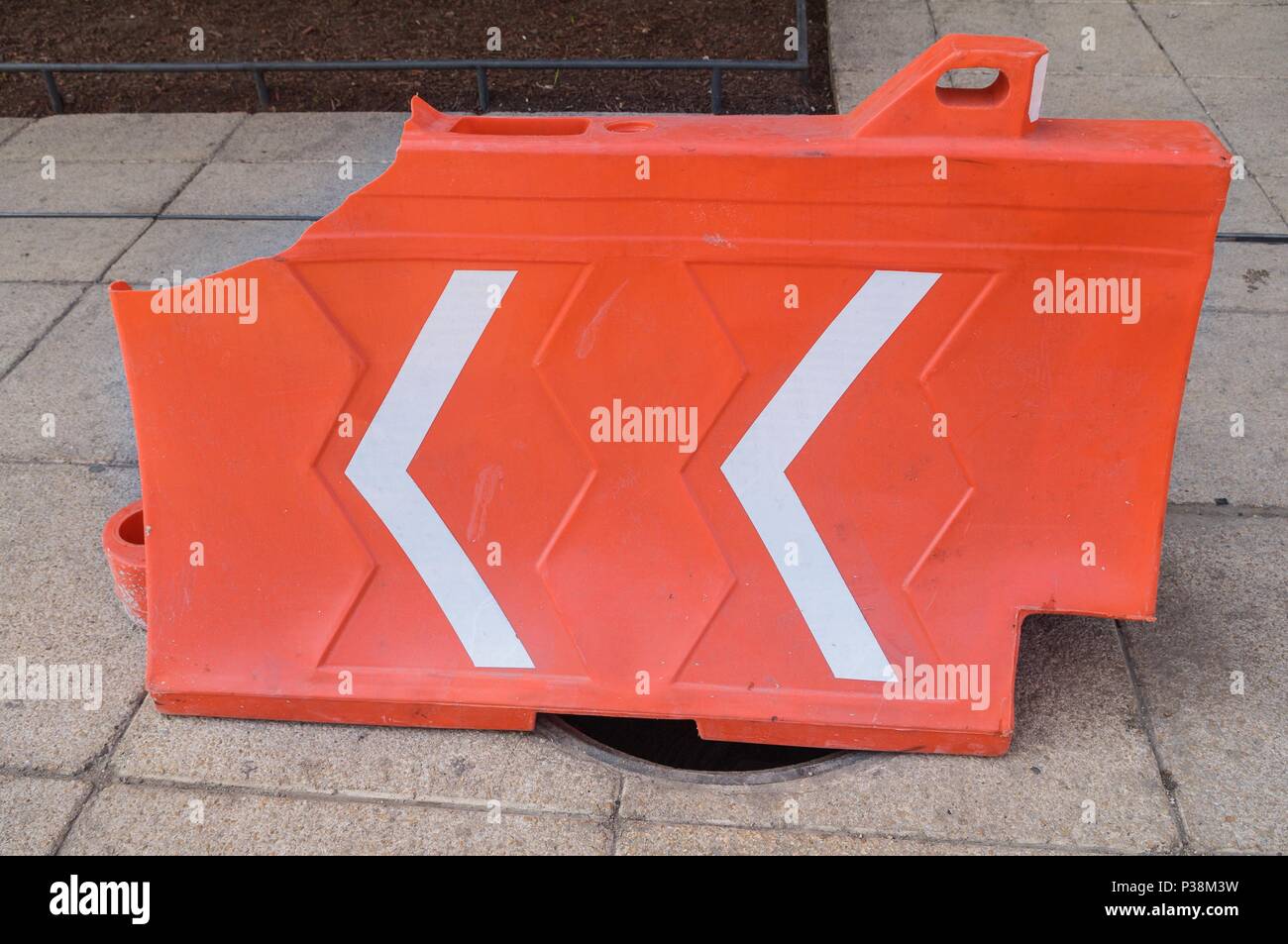 Broken culvert covered with an orange plastic structure used in ...
