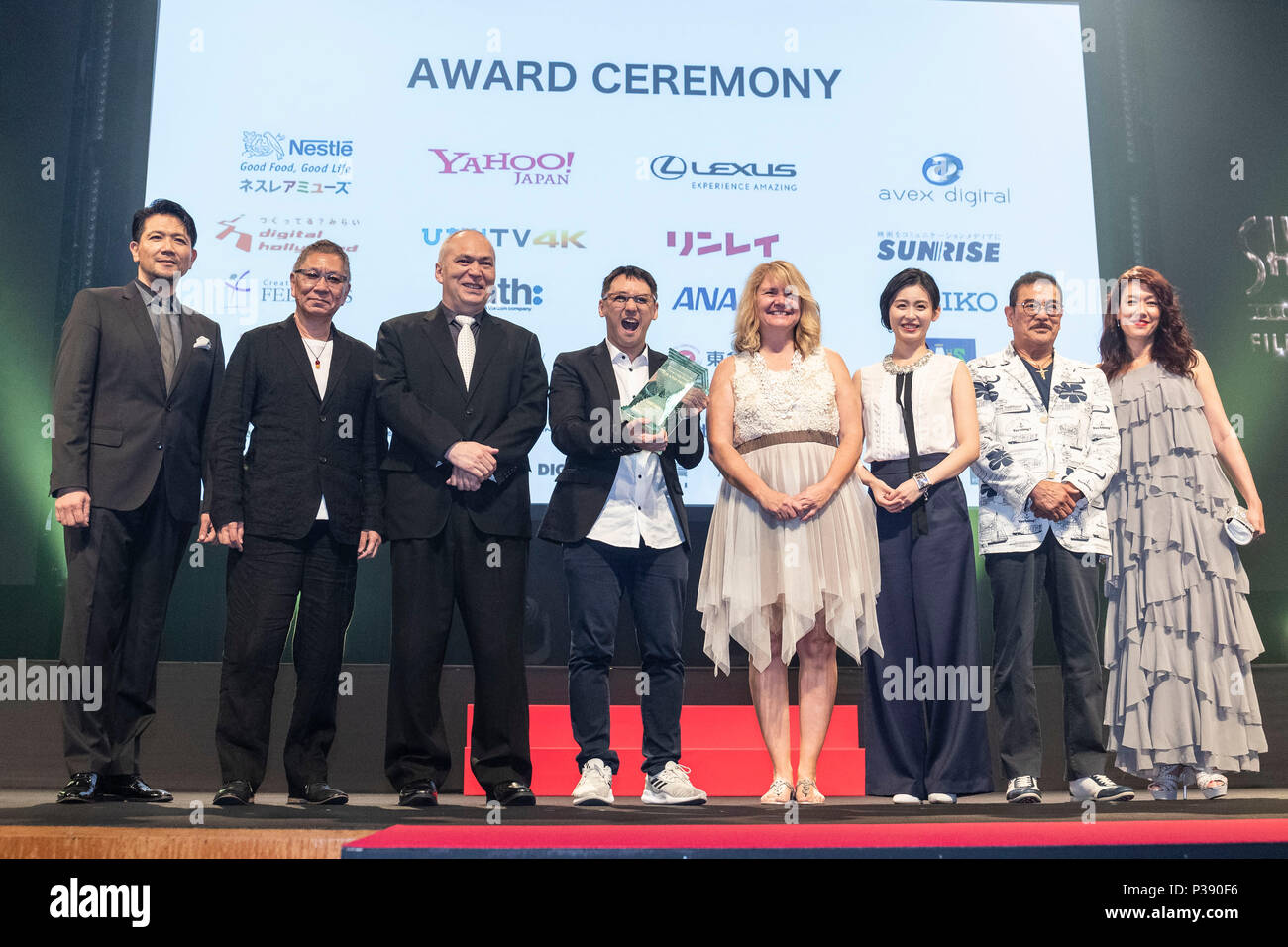 Singaporean director Yee Wei Chai (C) receives the Grand Prix (George ...