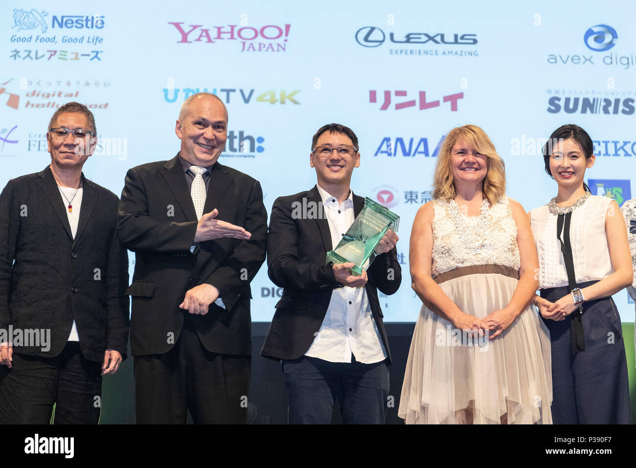 Singaporean director Yee Wei Chai (C) receives the Grand Prix (George ...