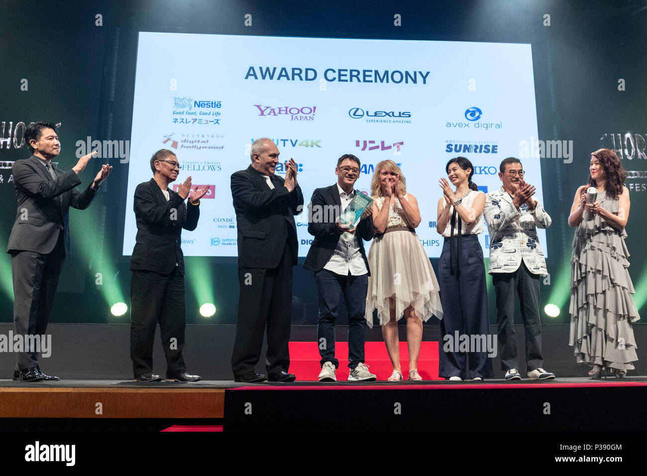 Singaporean director Yee Wei Chai (C) receives the Grand Prix (George ...