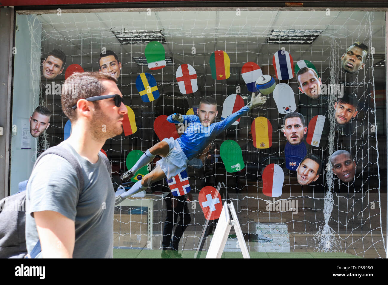 London UK. 18th June 2018. Party Masks featuring international football ...