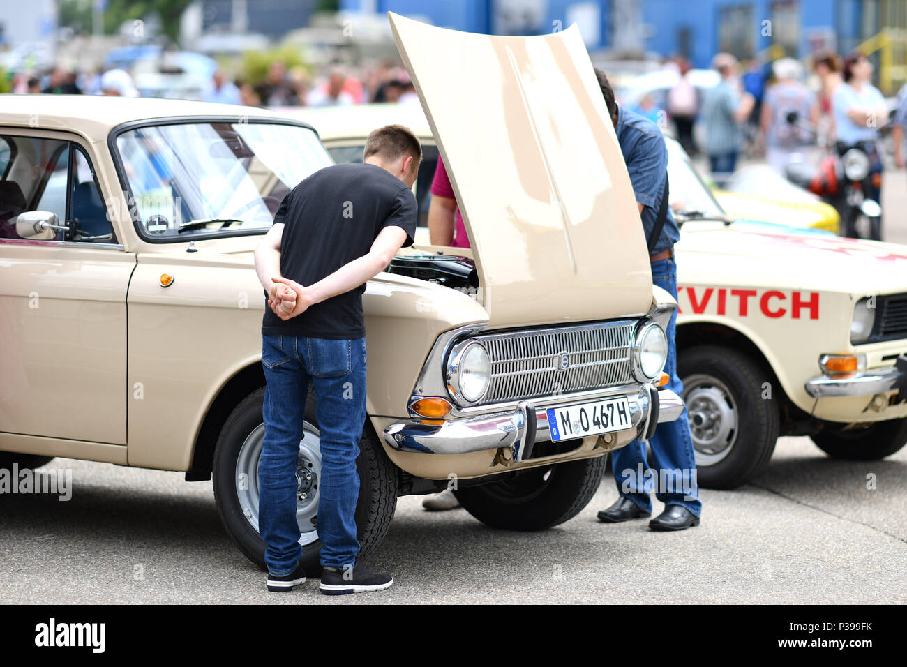 17 June 2018, Sinsheim, Germany: Visitors look at a car of the brand ...
