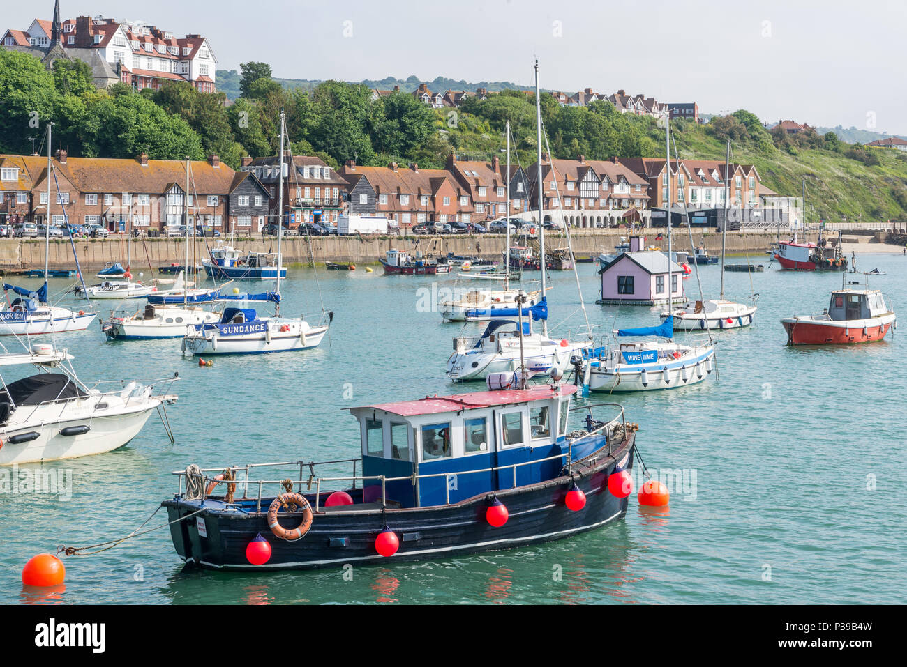 Small boats moored in the outer harbour at Folkestone, Kent, England ...