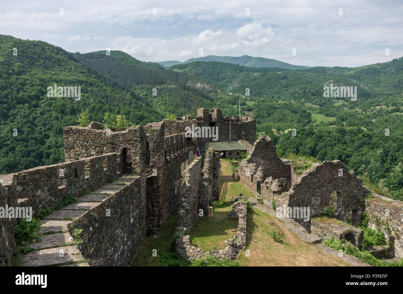 On the wall of medieval fortress Maglic, mountain range at background ...