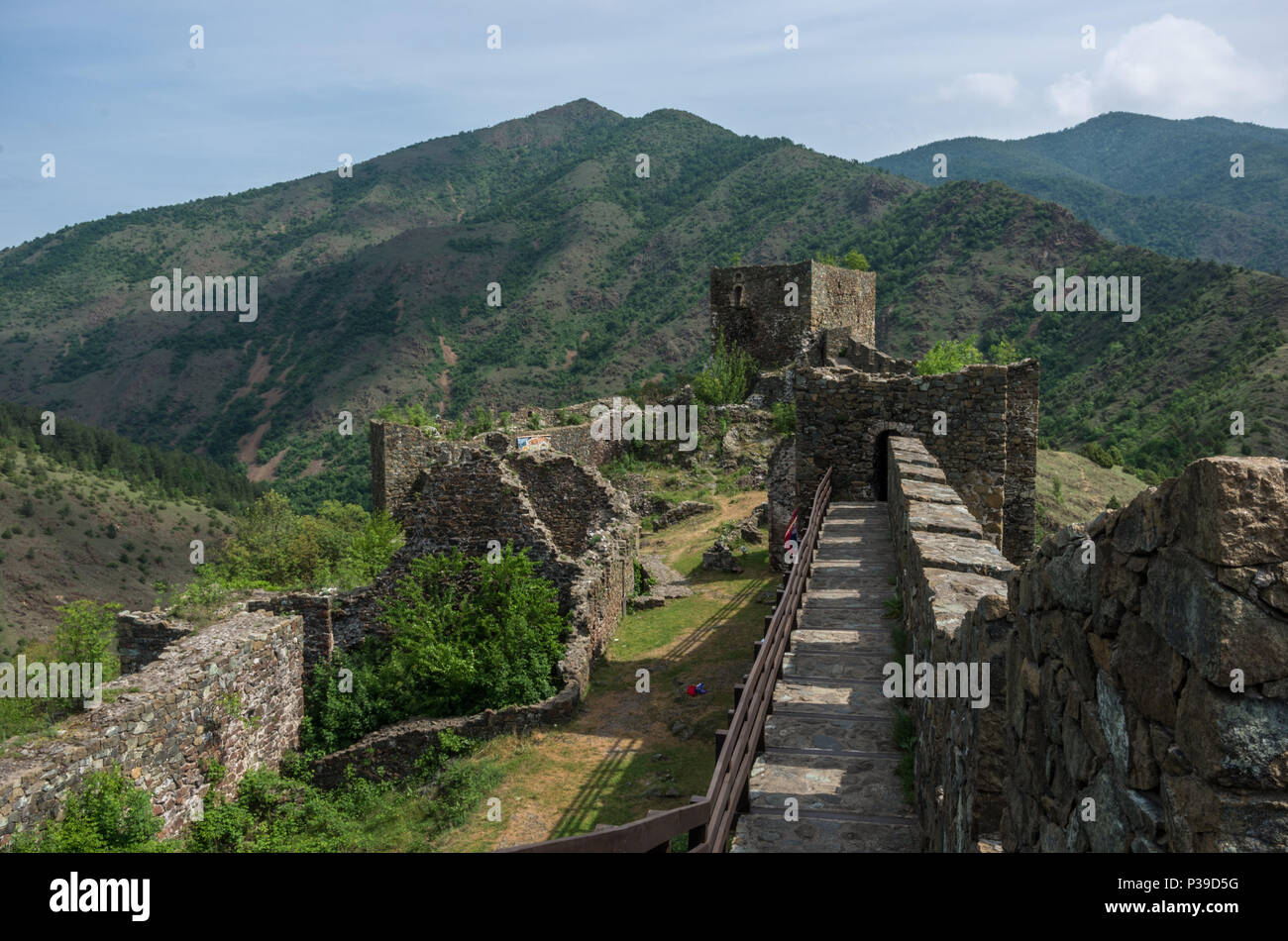 On the wall of medieval fortress Maglic, mountain range at background ...