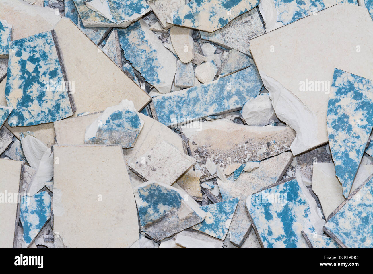 Broken tiles from demolition of old flooring. Texture of worn retro ...