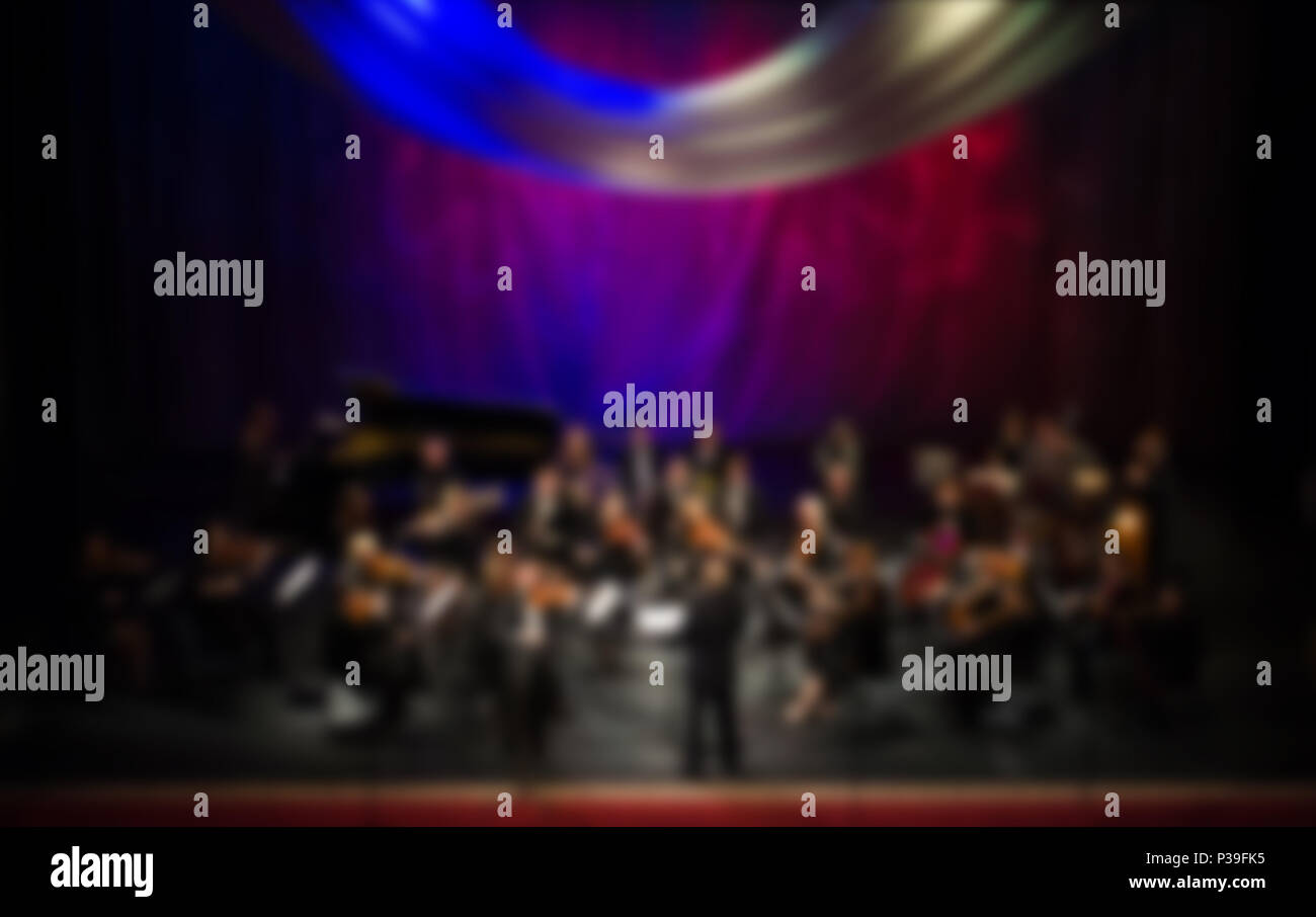 Artists symphony orchestra. abstract blurred image. Musician plays a ...