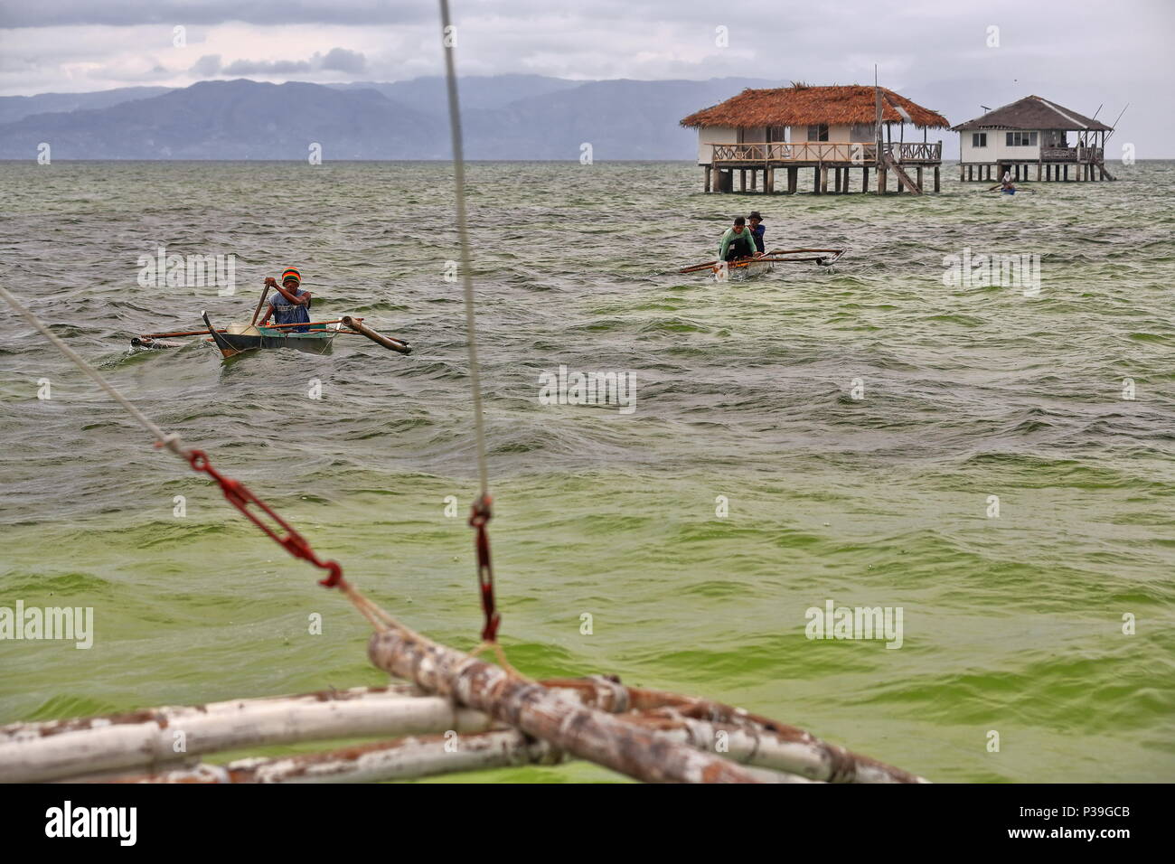 Filipino fishermen in boat in hi-res stock photography and images - Alamy