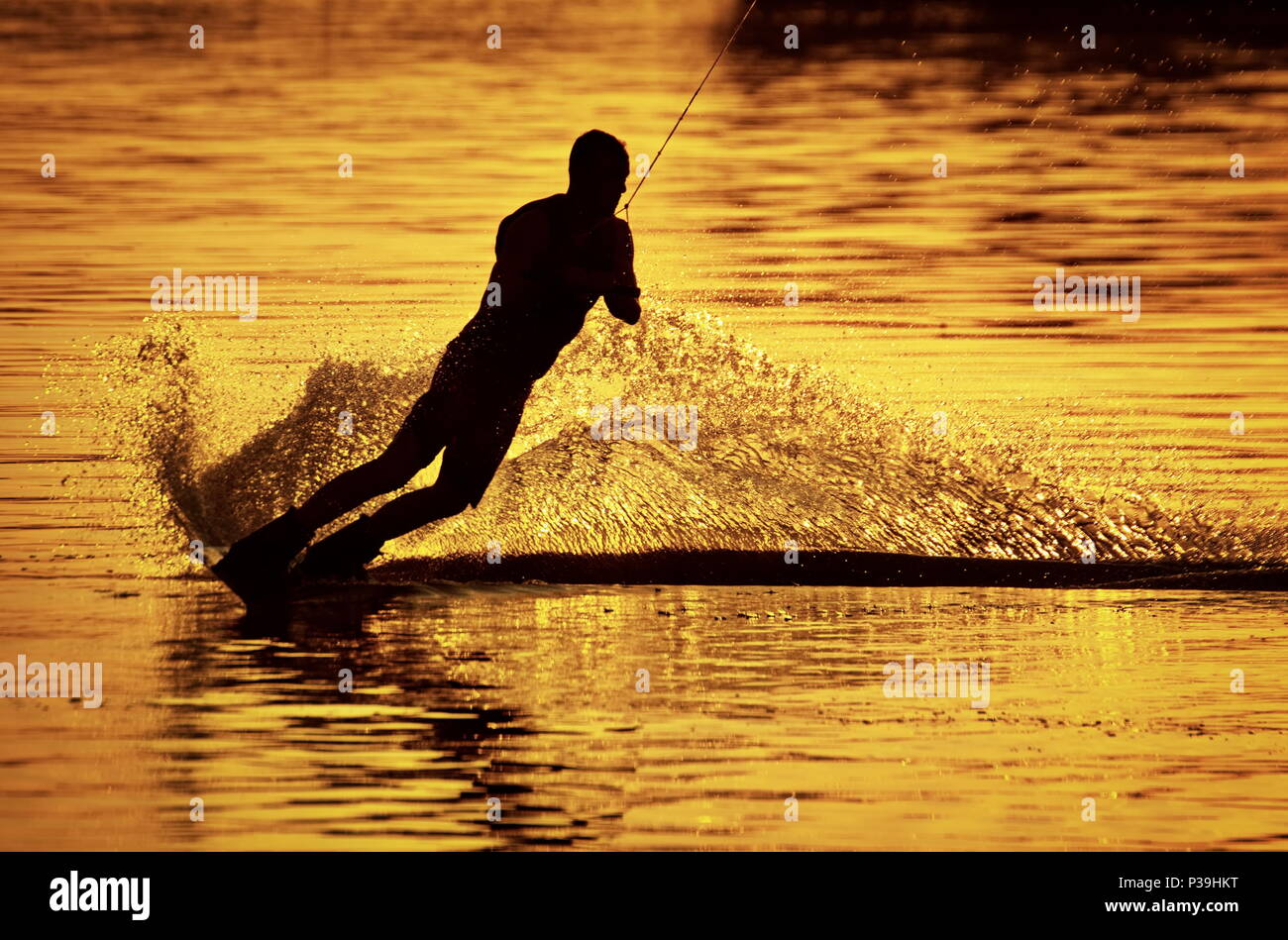 wakeboarder athlete doing wakeboard and wakeboarding jump Stock Photo ...