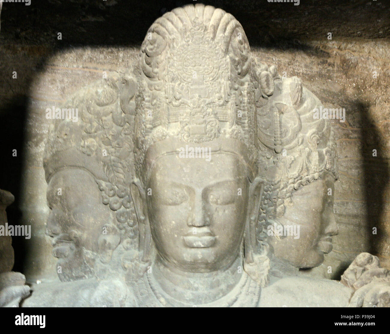 Stone Shiva head in a cave, India Stock Photo - Alamy
