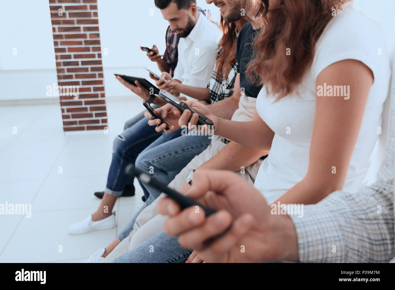 business team using a mobile device Stock Photo - Alamy