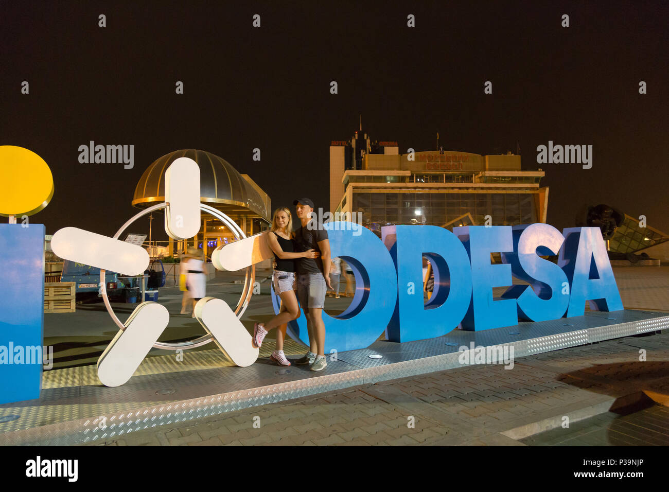 Odessa, Ukraine, visitors take souvenir photos at Odesa lettering at ...