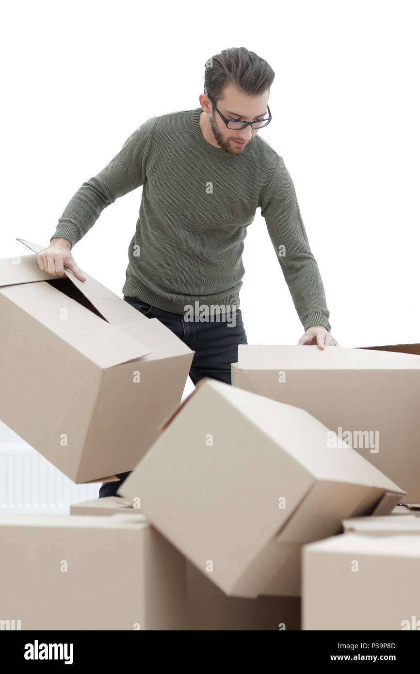 confident man unpacking boxes in the new house Stock Photo - Alamy