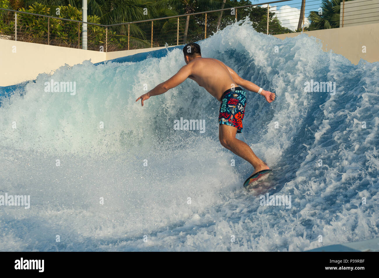 Singapore, Republic of Singapore, surfing at Wave House on Sentosa ...