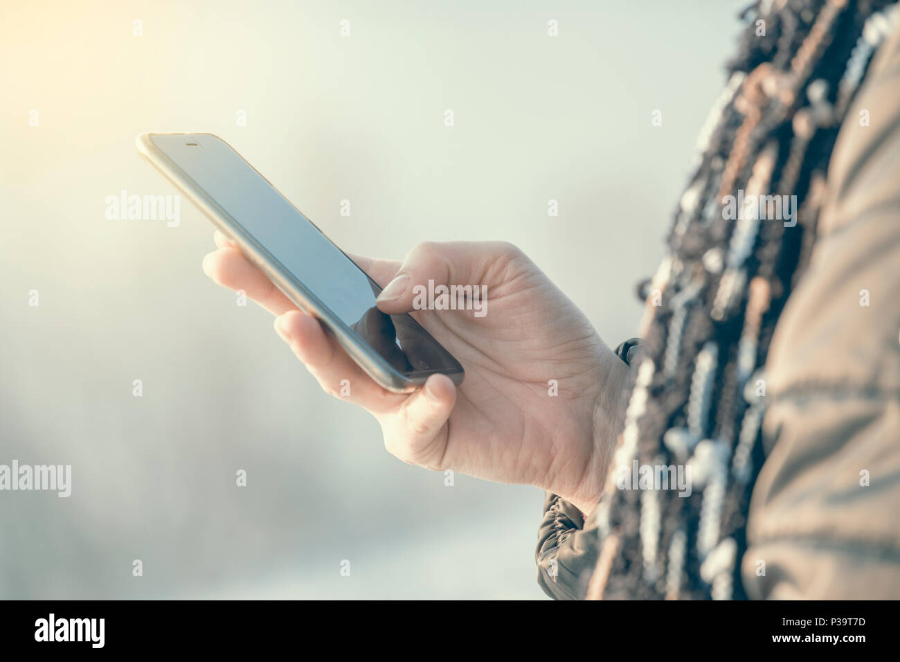 Woman hands holding smartphone, touching a mobile phone screen. Vintage ...