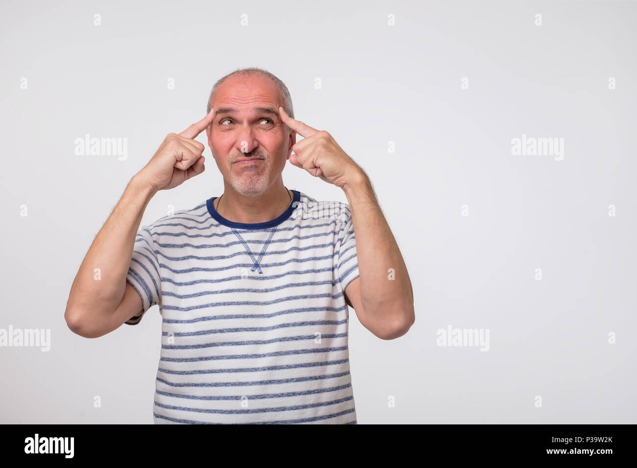 Mature man tryong to make difficult decision or making plan. Concept of ...