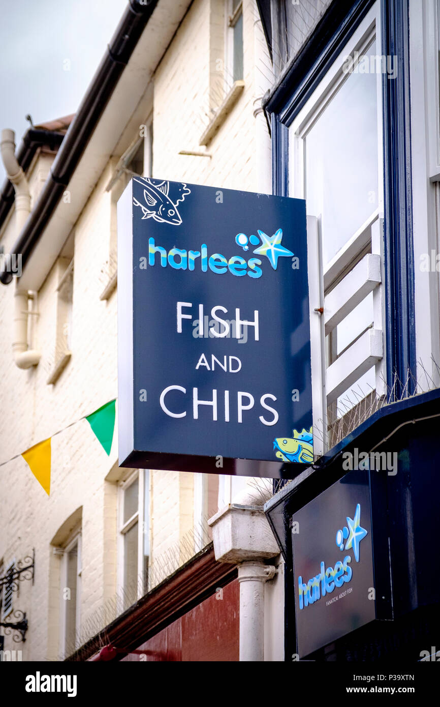 Harlees fish and chip shop sign Stock Photo - Alamy