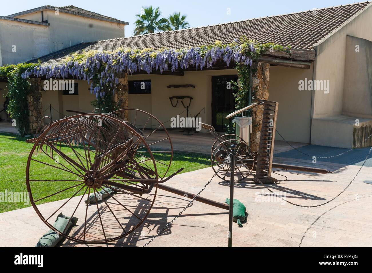 Metal farm implements on a farm in Italy Stock Photo - Alamy