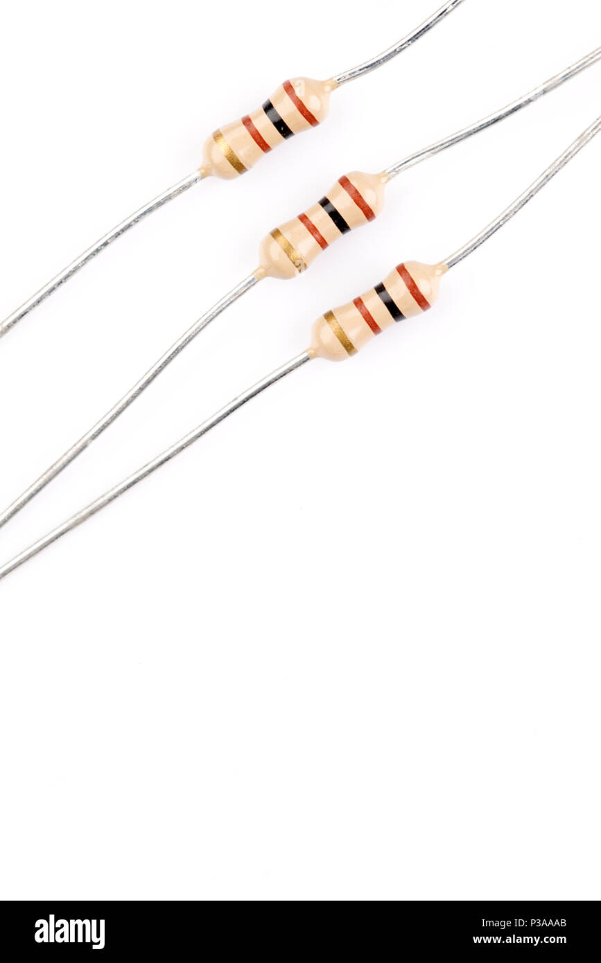Three electrical resistors isolated on a white background. Electric ...
