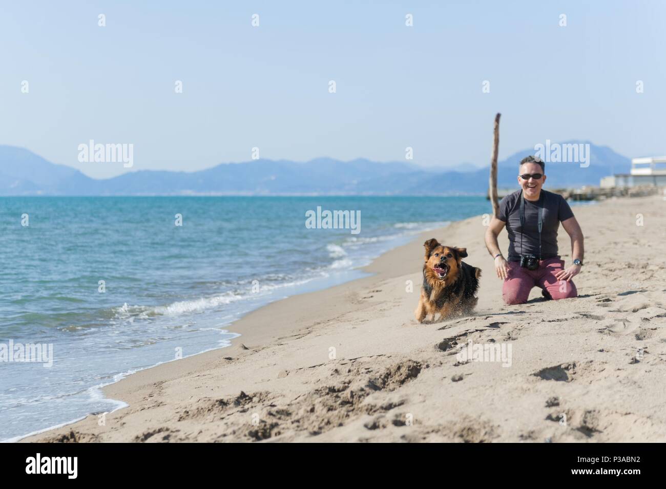 Boy having fun with dog outside hi-res stock photography and images - Alamy