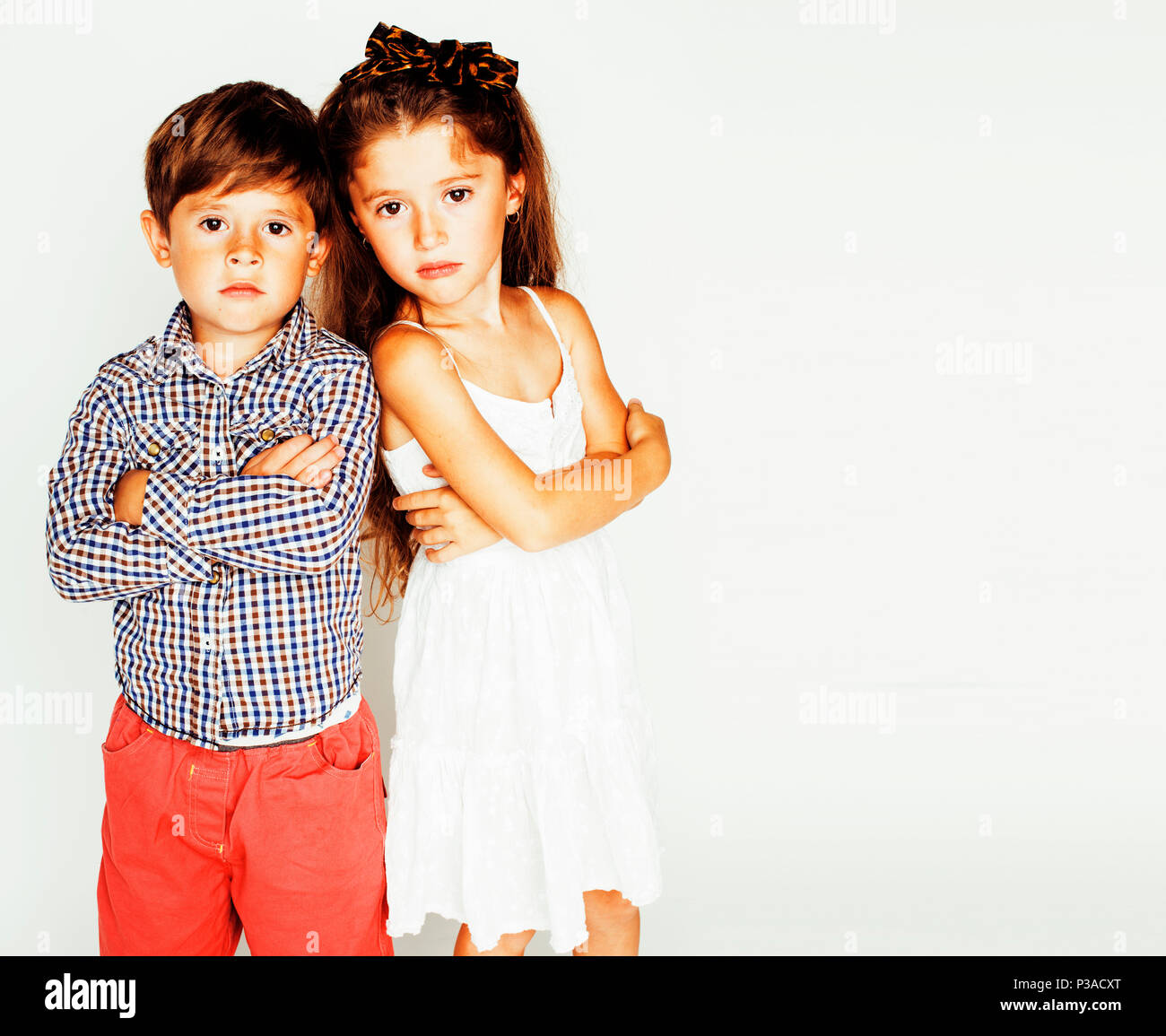 little cute boy and girl hugging playing on white background, ha Stock Photo - Alamy