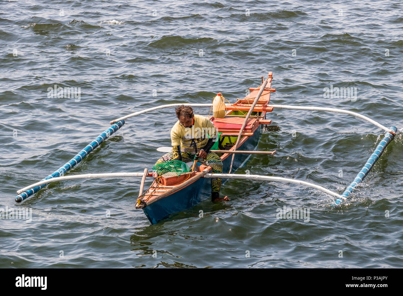Fishing off coast of Manila Philippines Stock Photo - Alamy