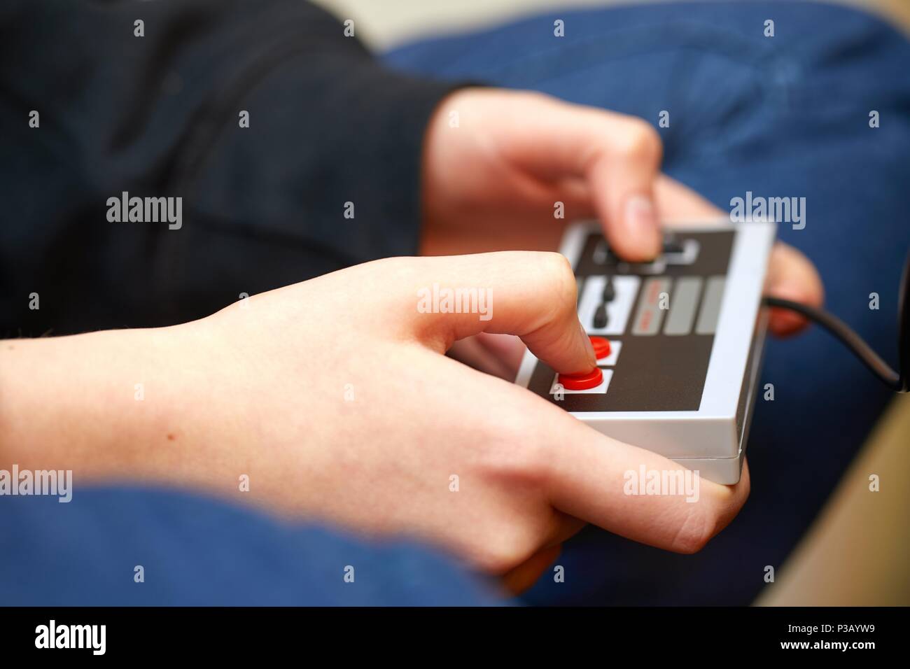 Playing an old gaming console Stock Photo - Alamy