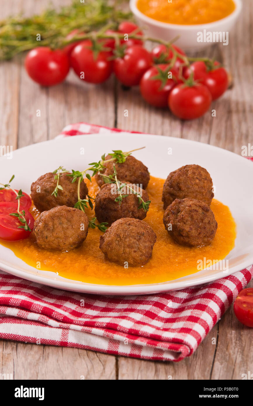 Meatballs with carrot purée Stock Photo - Alamy