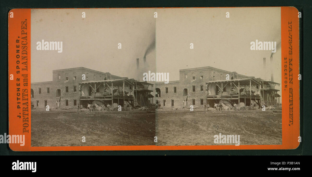 188 Men lifting hay into a 2-story shed, Stockton, California, by ...